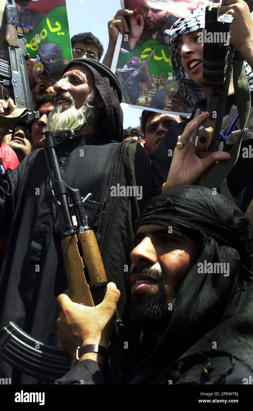 Iraqi militants loyal to the Shiite cleric Muqtada al-Sadr demonstrate ...
