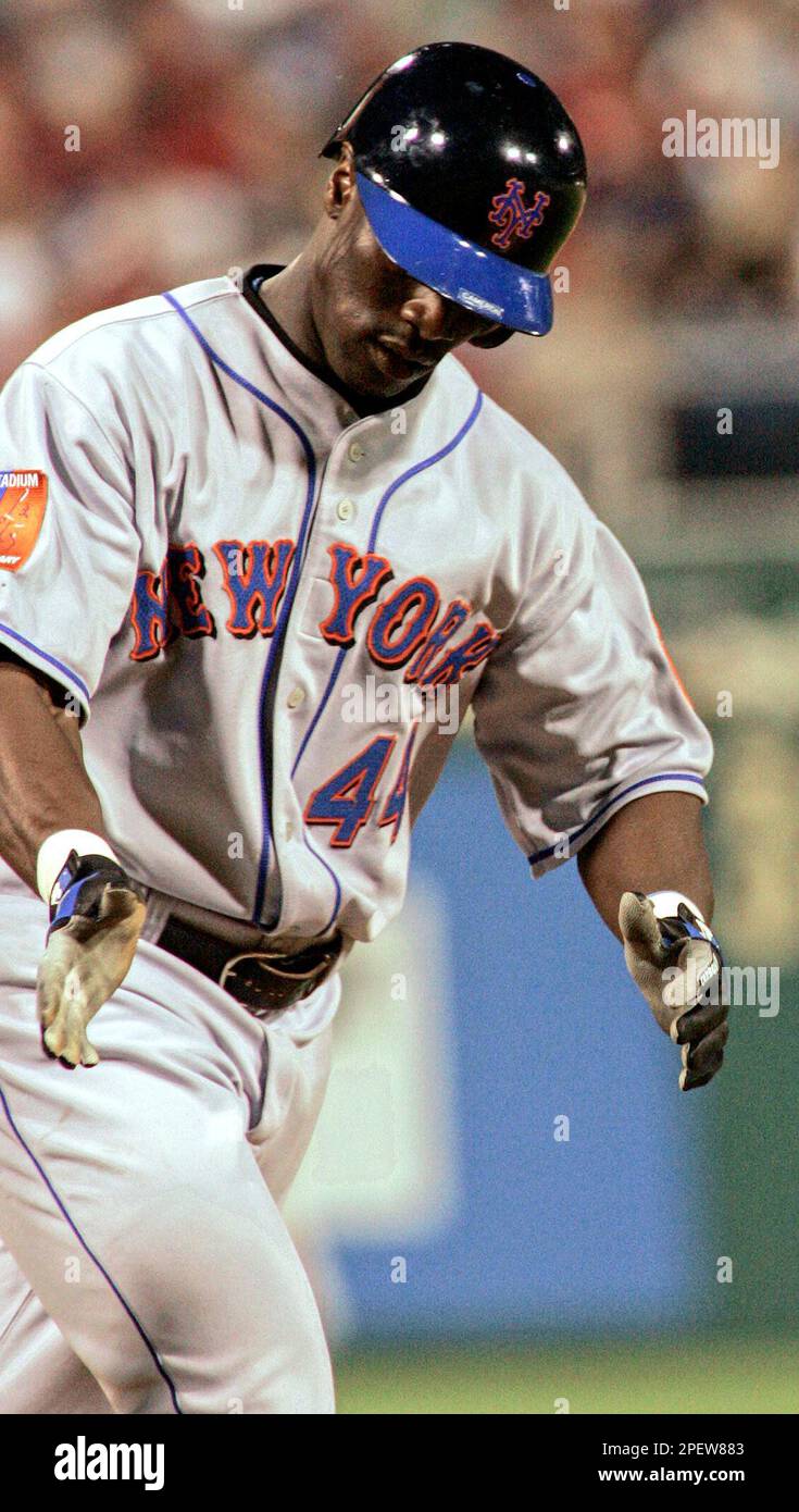 New York Mets' Mike Cameron circles the bases after his two-run homer ...
