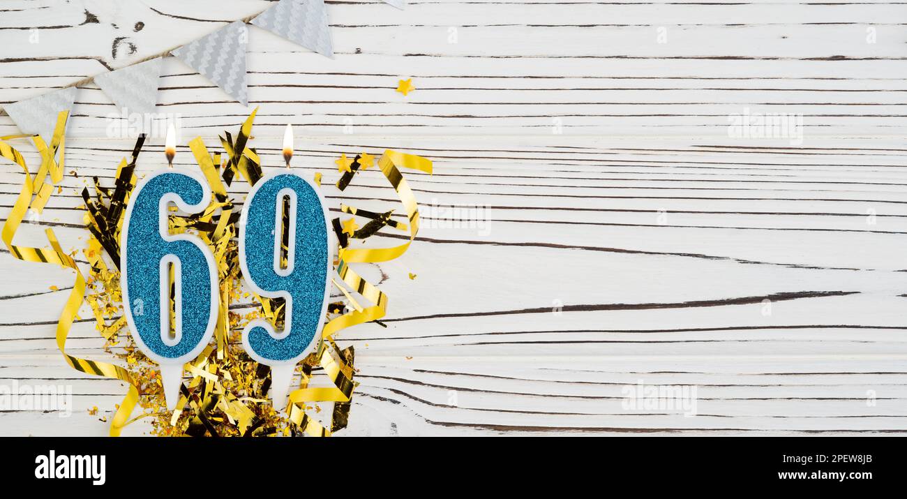 Number 69 Blue Celebration Candle On White Wooden Background Happy