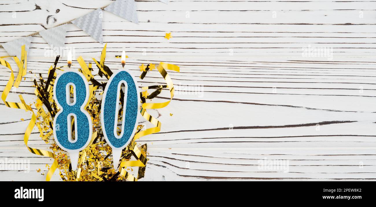 Blue candle number, digit eighty. Birthday greeting card with ...