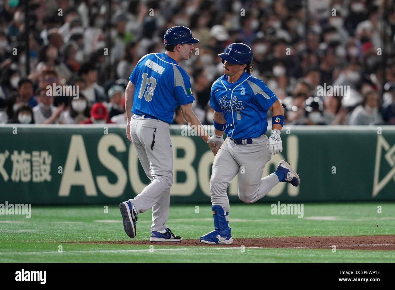 Dominic Fletcher of Italy celebrates with third base coach Chris ...
