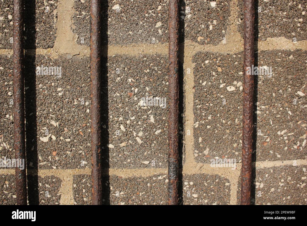 Metal rebars and prison bars serving as a protective and security ...