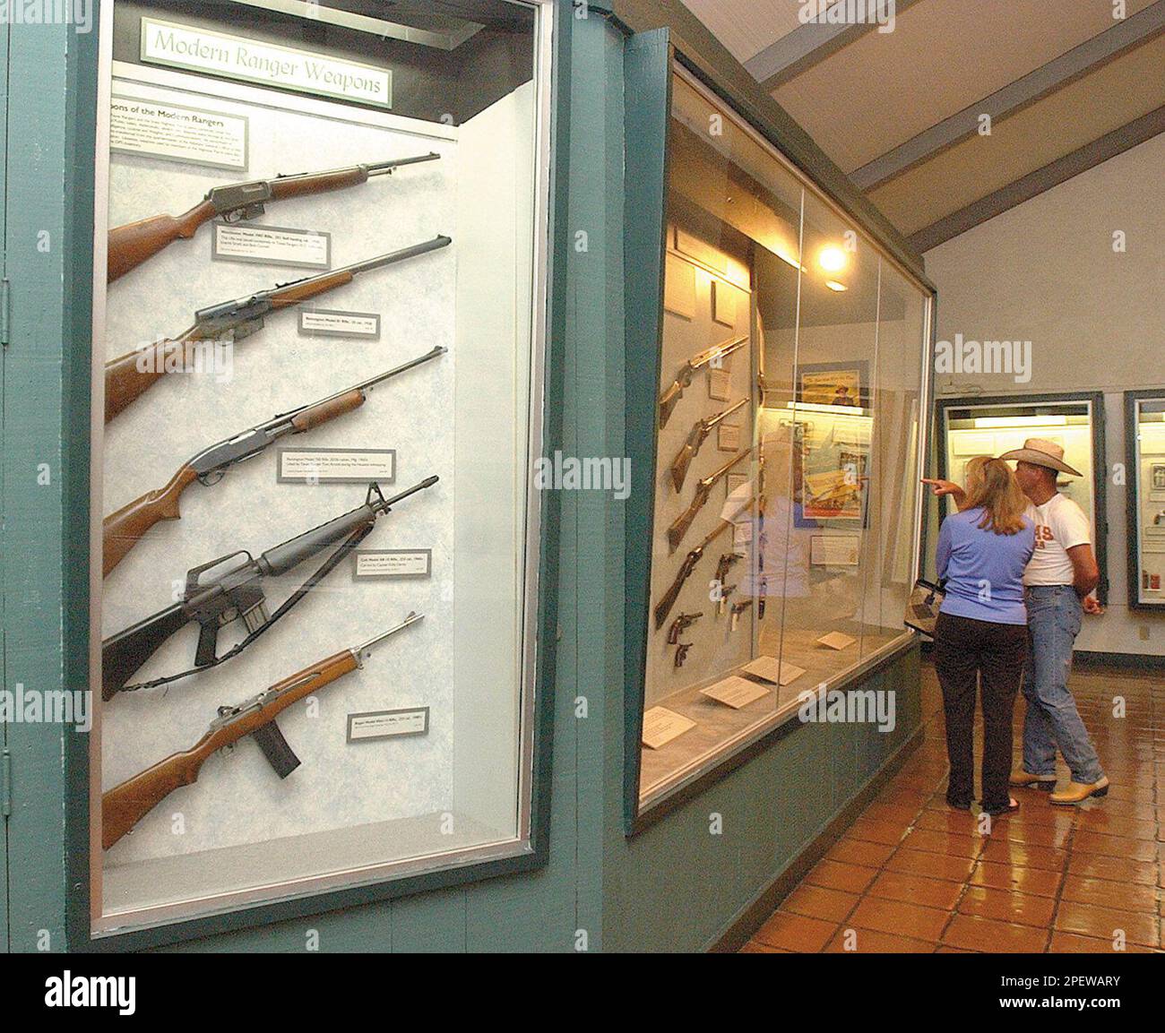 Vistors look at gun displays at the Texas Ranger Museum in Waco ...