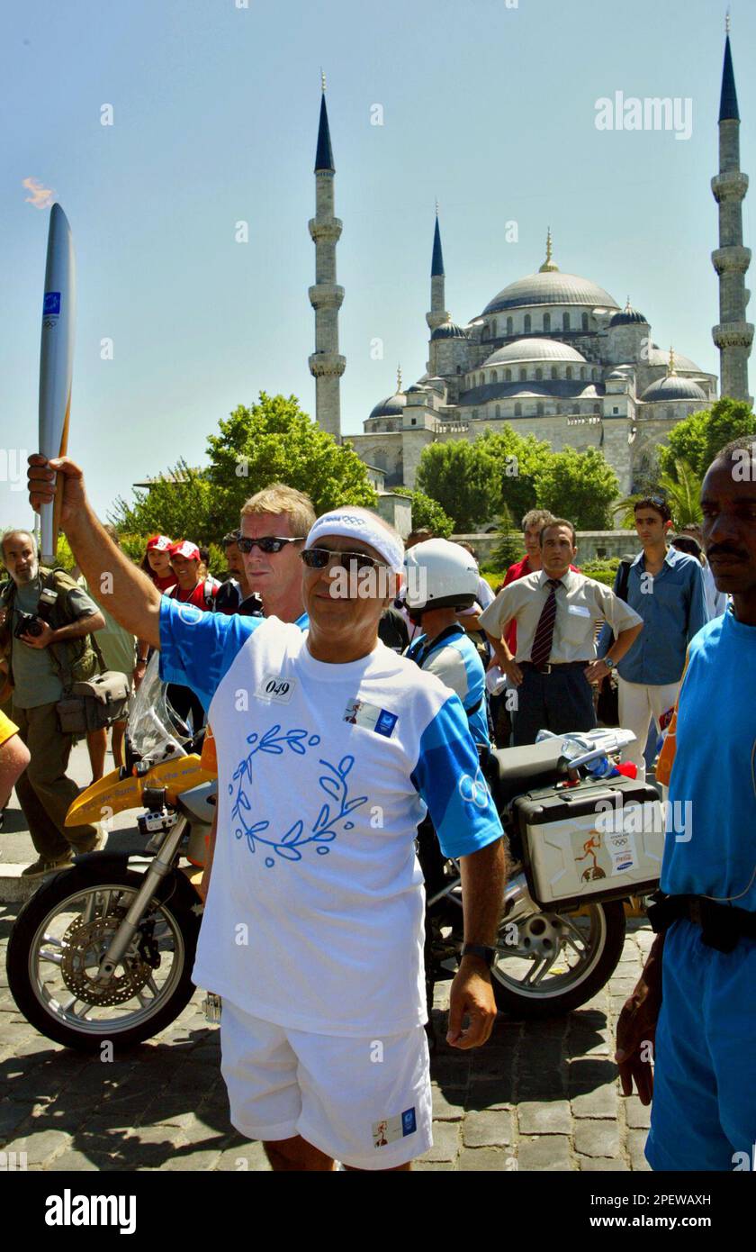 Turkish journalist Fikret Ercan, with the Ottoman era Blue mosque in ...