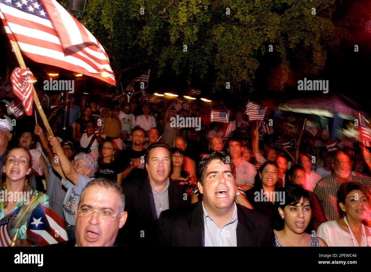 People cheer and wave flags during the July 4, 2004 celebration in San ...