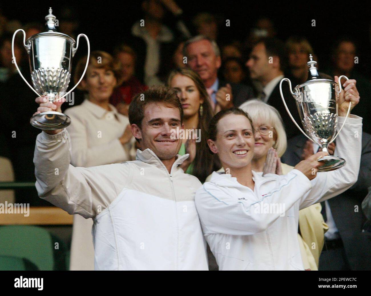 Zimbabwe's Wayne Black and Cara Black hold the Mixed Doubles trophy ...