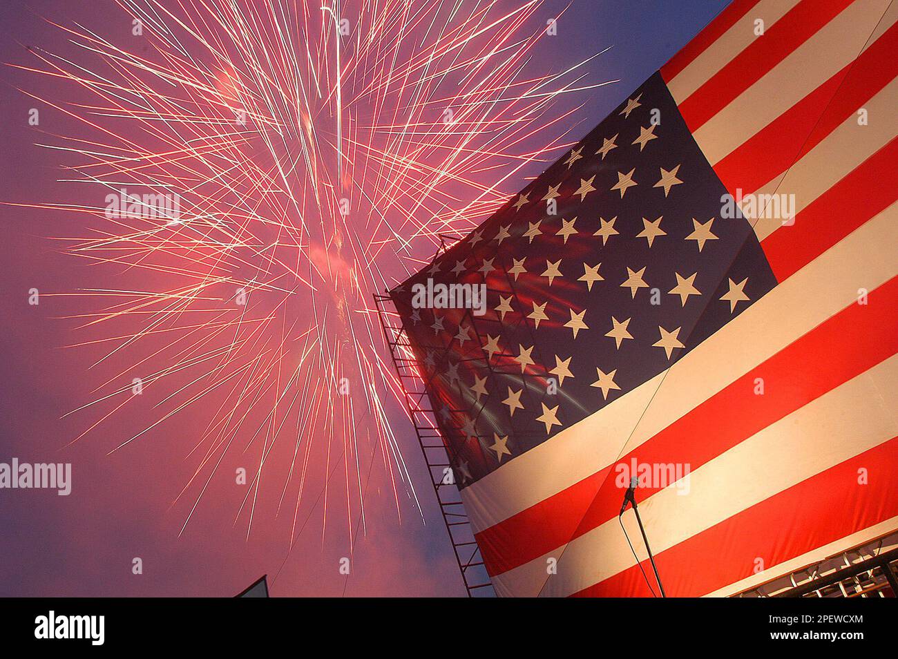 A fireworks display lights-up the night sky over a 50 foot wide ...