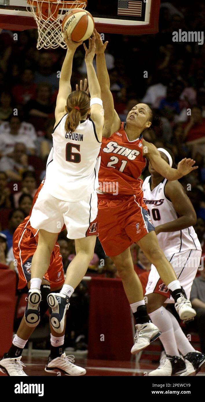 Charlotte Sting's Allison Feaster (21) tries to stop Houston Comets ...