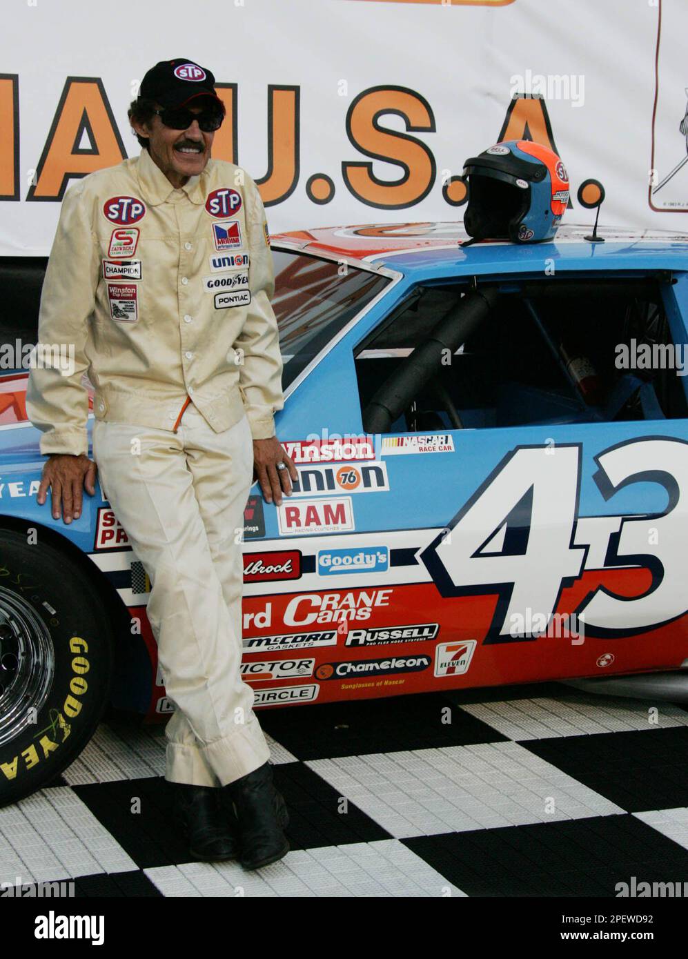 NASCAR driving legend Richard Petty poses in Victory Lane along with ...