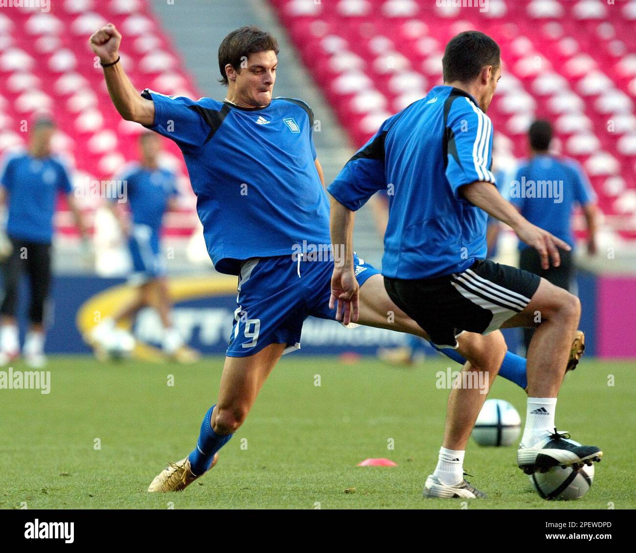 Angelos Charisteas, left, and an unidentified player of the Greek ...