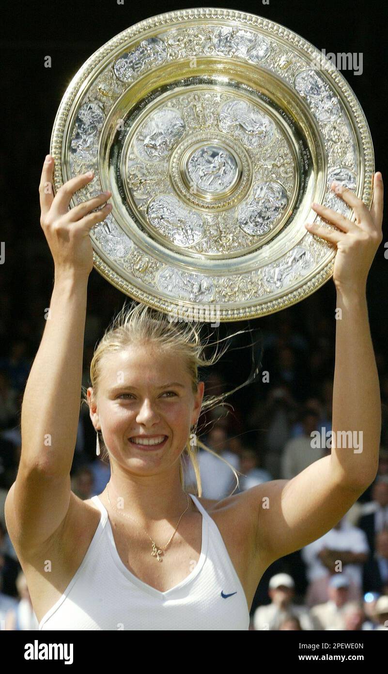 Russia's Maria Sharapova hold the winner's trophy after defeating ...