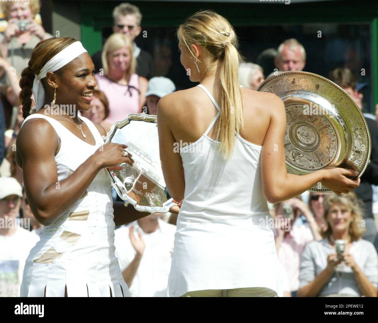 Russia's Maria Sharapova, right, and Serena Williams compare trophies ...