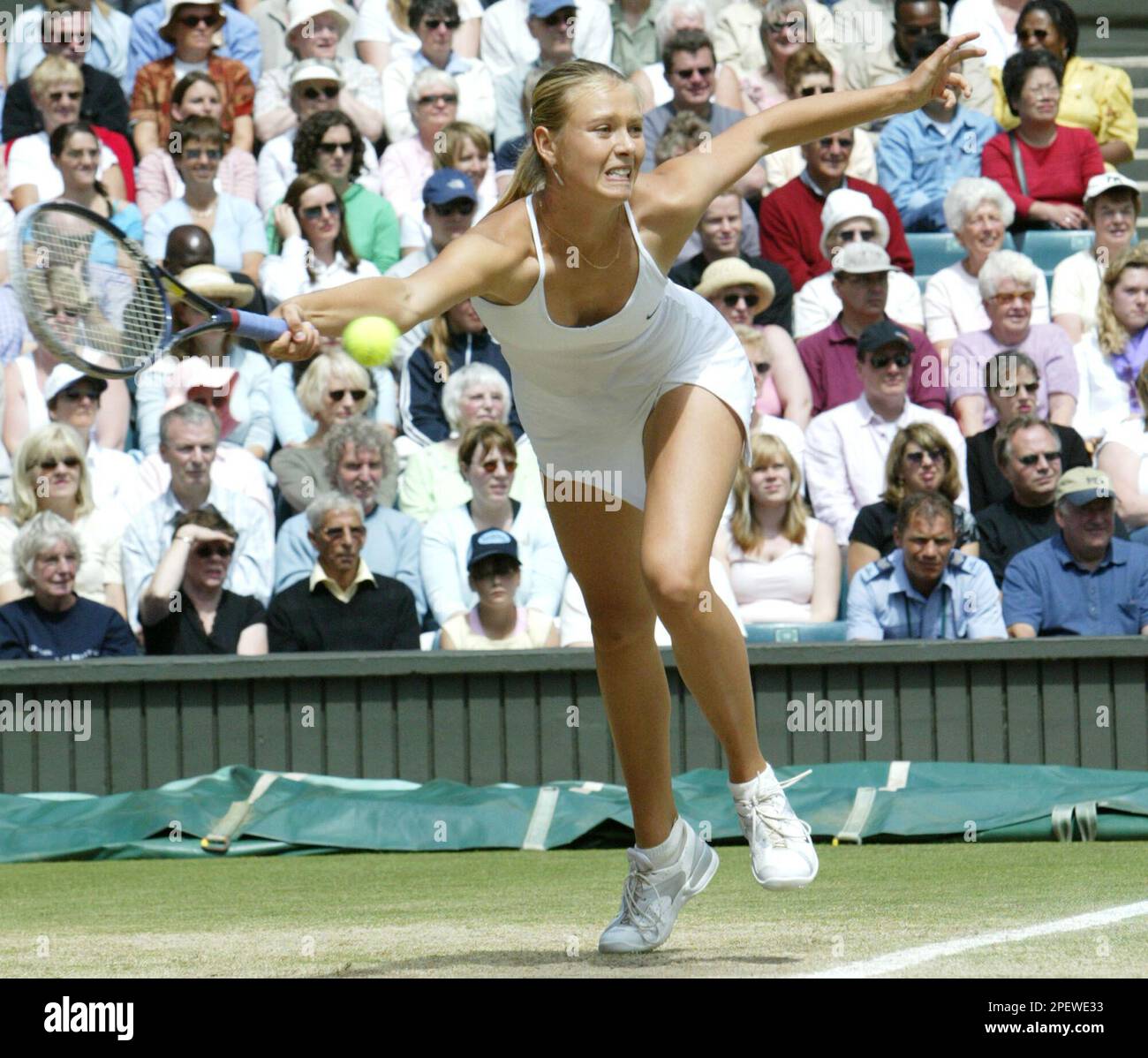 Russia's maria Sharapova stretches to return a shot from defending ...