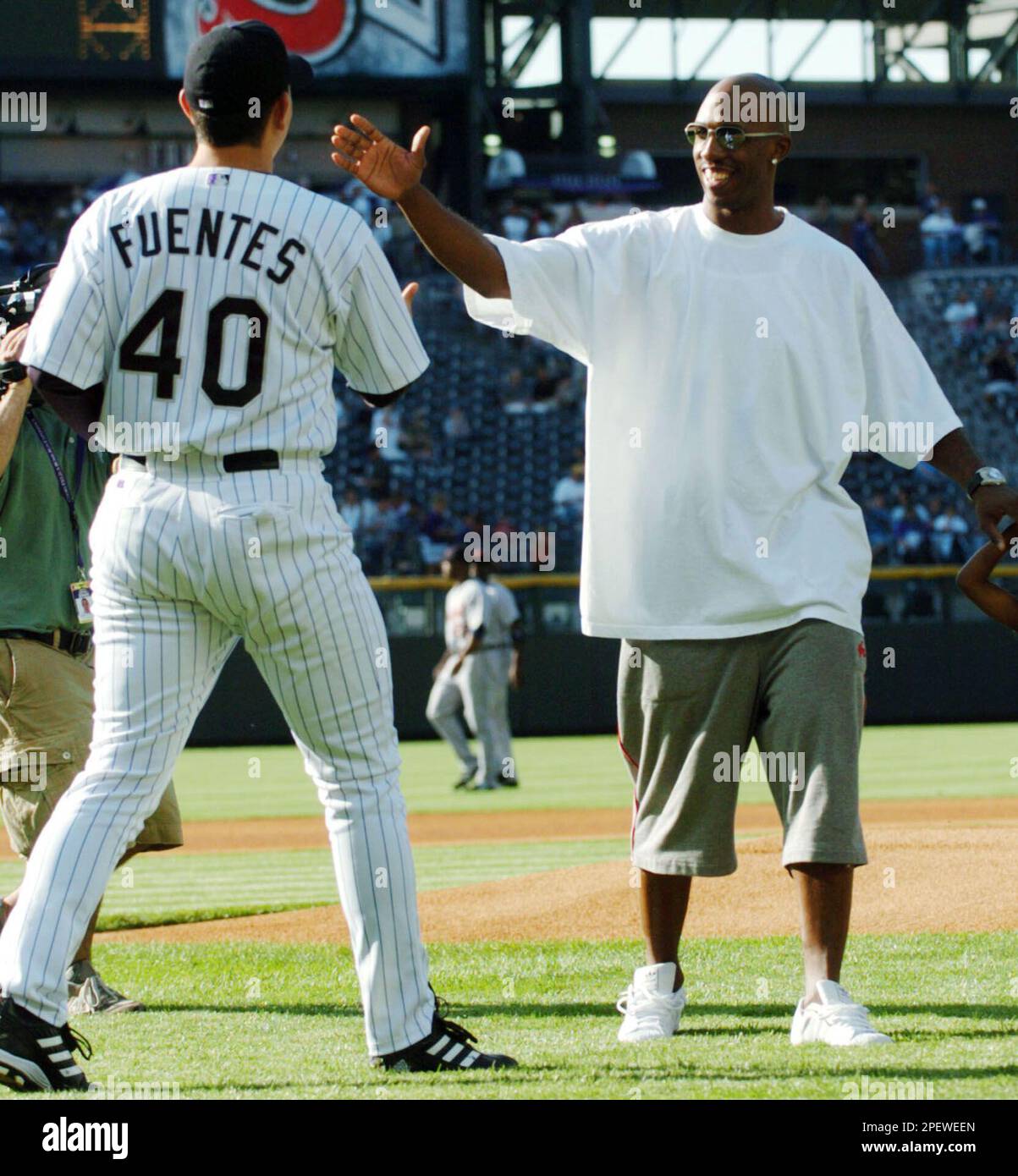Colorado Rockies relief pitcher Brian Fuentes, left, congratulates ...