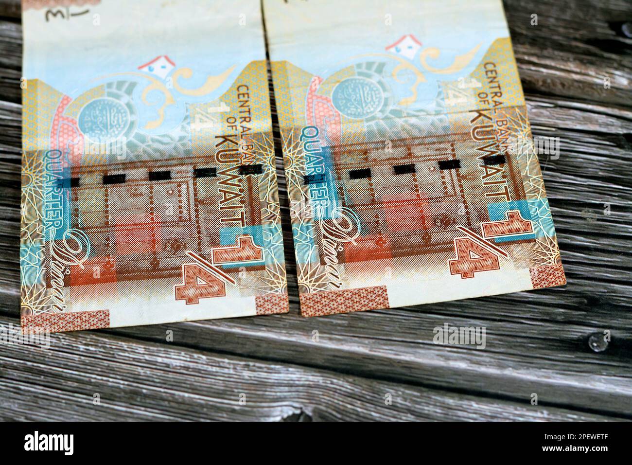 The reverse side of Kuwaiti quarter dinar brown paper banknote cash ...