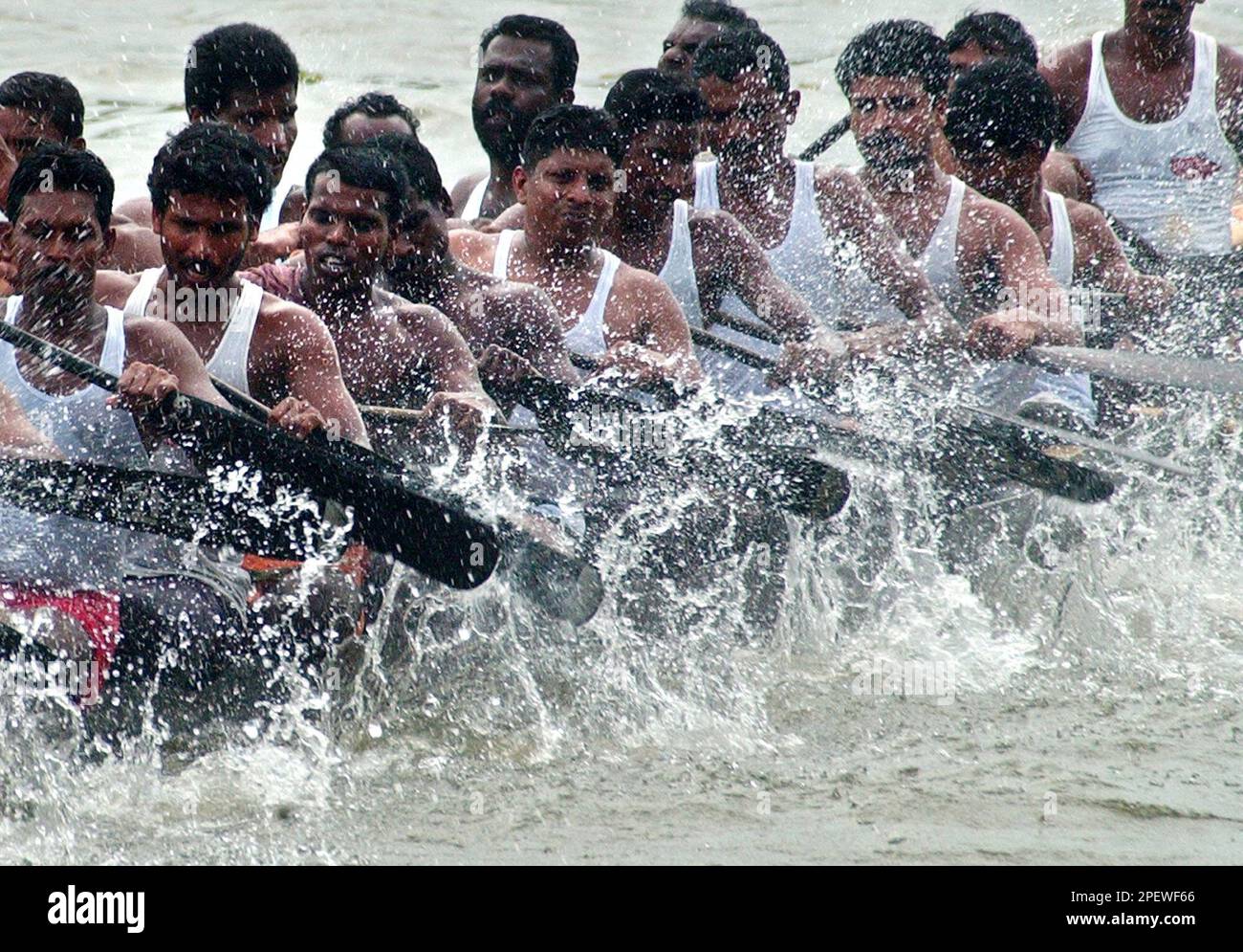 Boatmen paddle during the first race, heralding the start of the race ...
