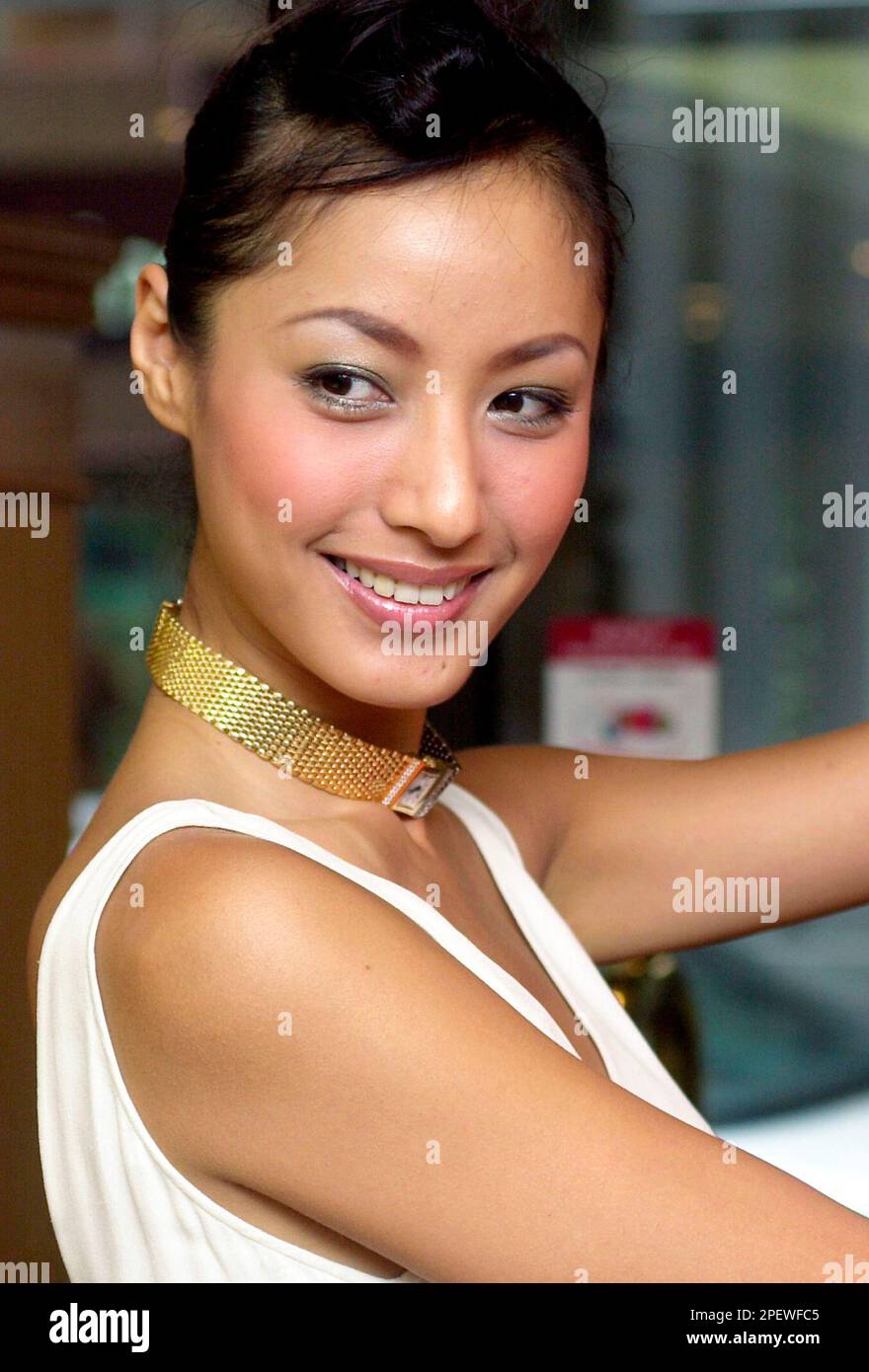 Hong Kong actress CoCo Chiang poses for photographers at a Hong Kong shopping mall, Friday, July ...