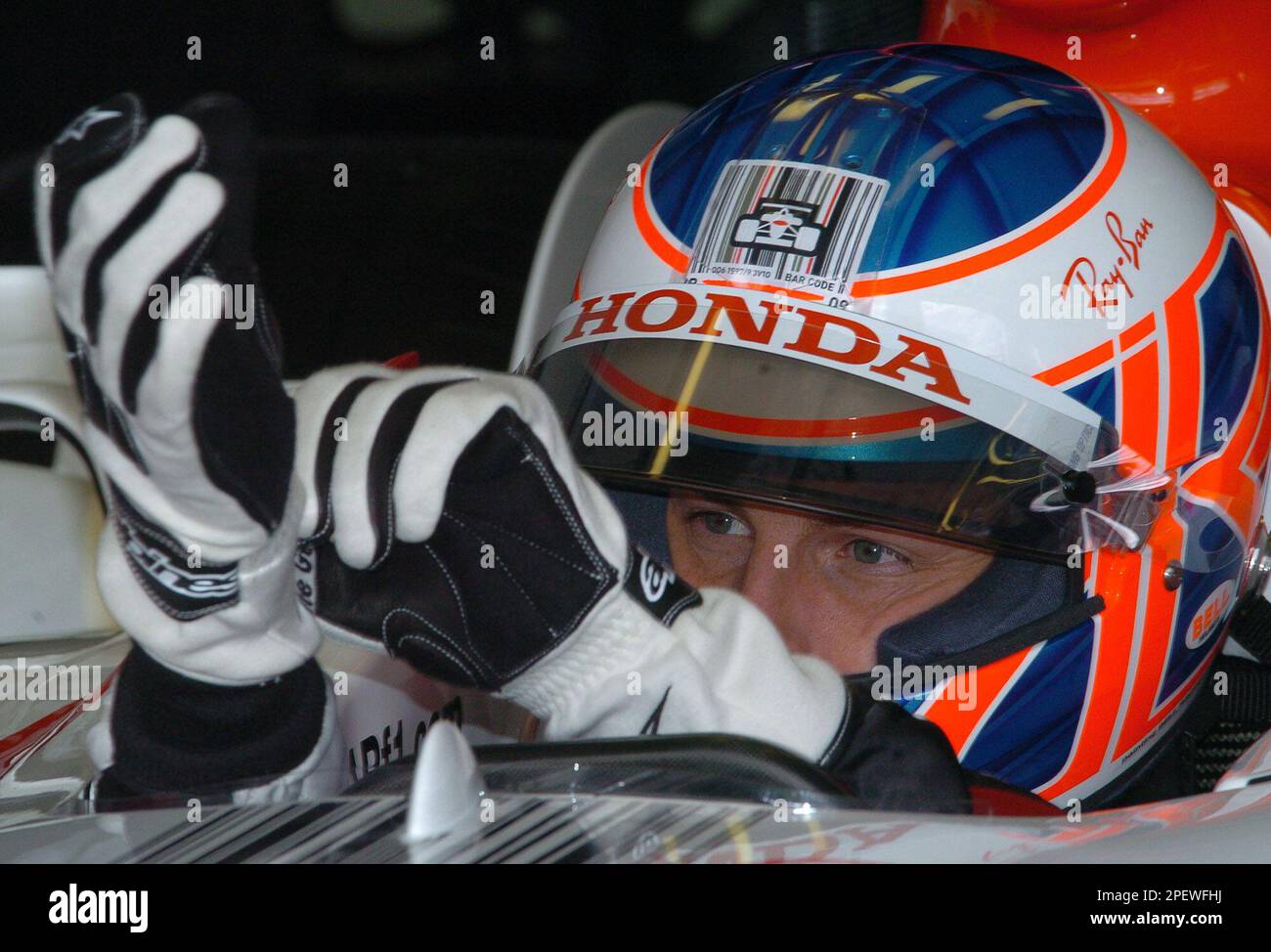 British Bar Honda F1 driver Jenson Button puts on his gloves, Friday ...