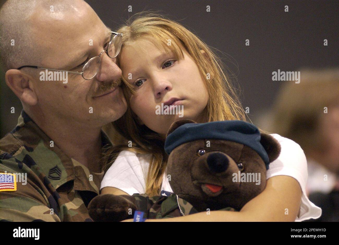 Sgt. First Class Kent Nowland, of Twin Falls, Idaho, sits with his 9 ...