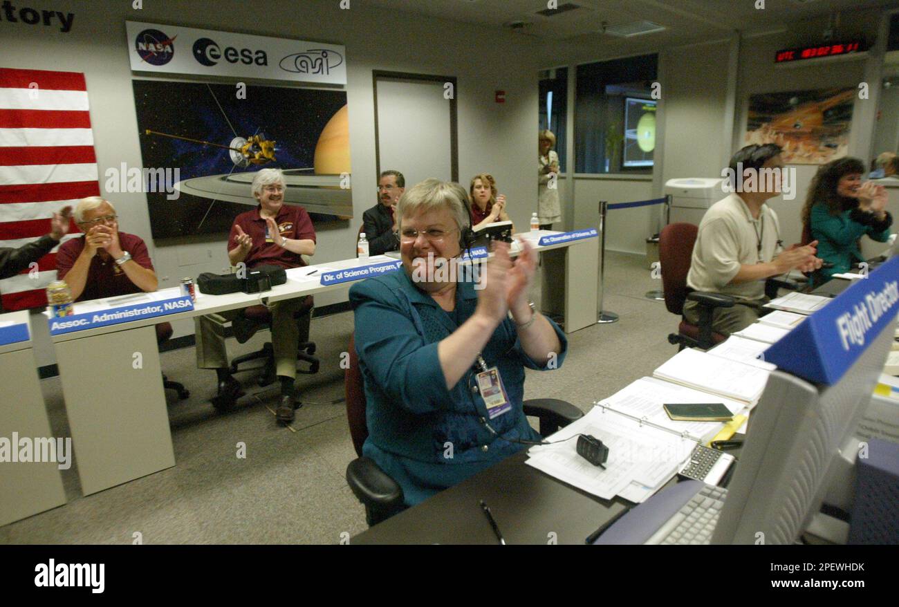 Julie Webster, Flight Director reacts in the mission control room as ...