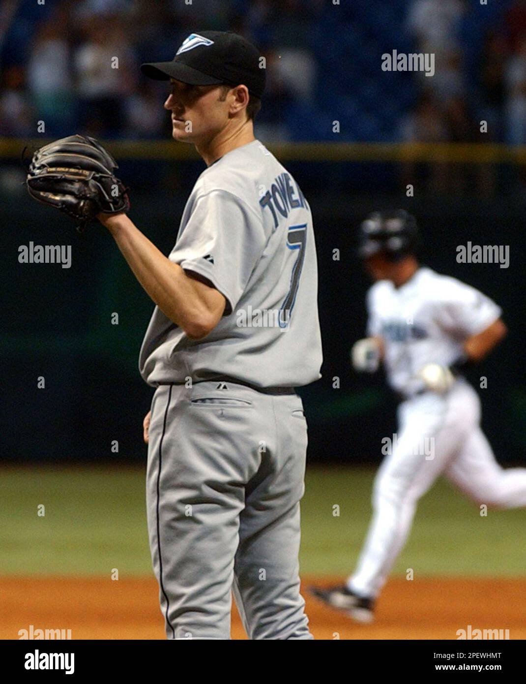 Toronto Blue Jays pitcher Josh Towers looks for a new baseball as Tampa ...