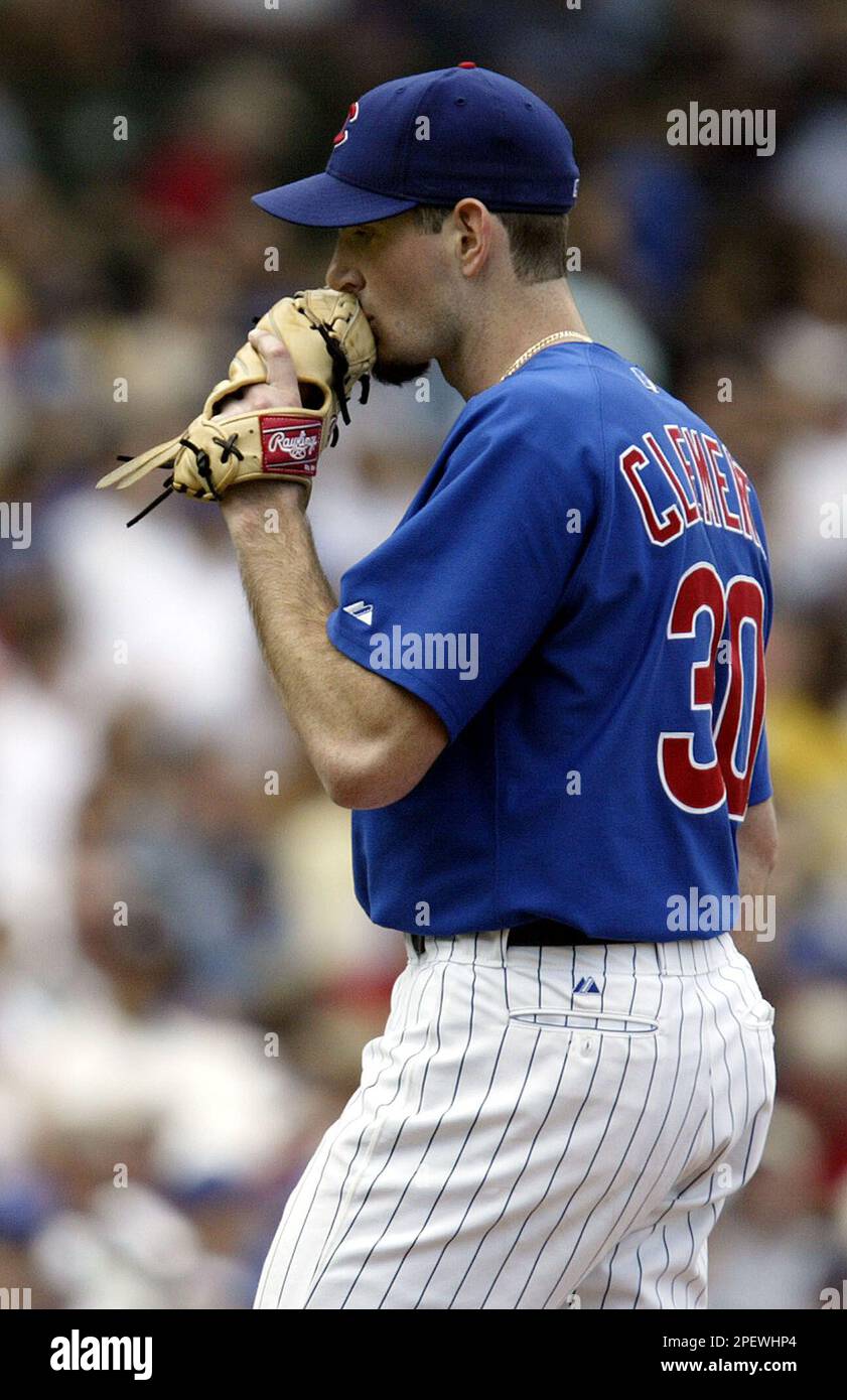Chicago Cubs pitcher Matt Clement reacts after throwing a wild pitch in ...