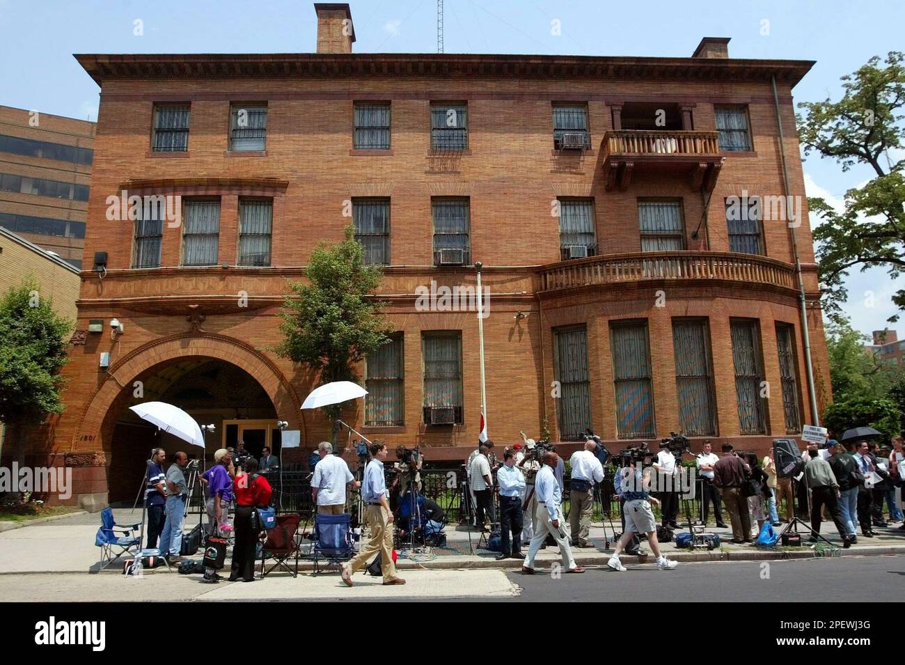 Members of the media gather in front of the newly re-opened Iraq ...
