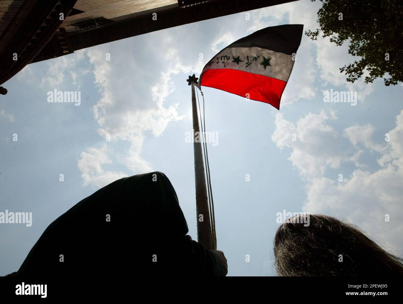 The Iraqi flag flies over the newly re-opened Iraqi Embassy during a ...
