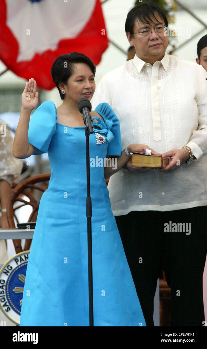 Philippine President Gloria Macapagal Arroyo (left) takes her oath as ...