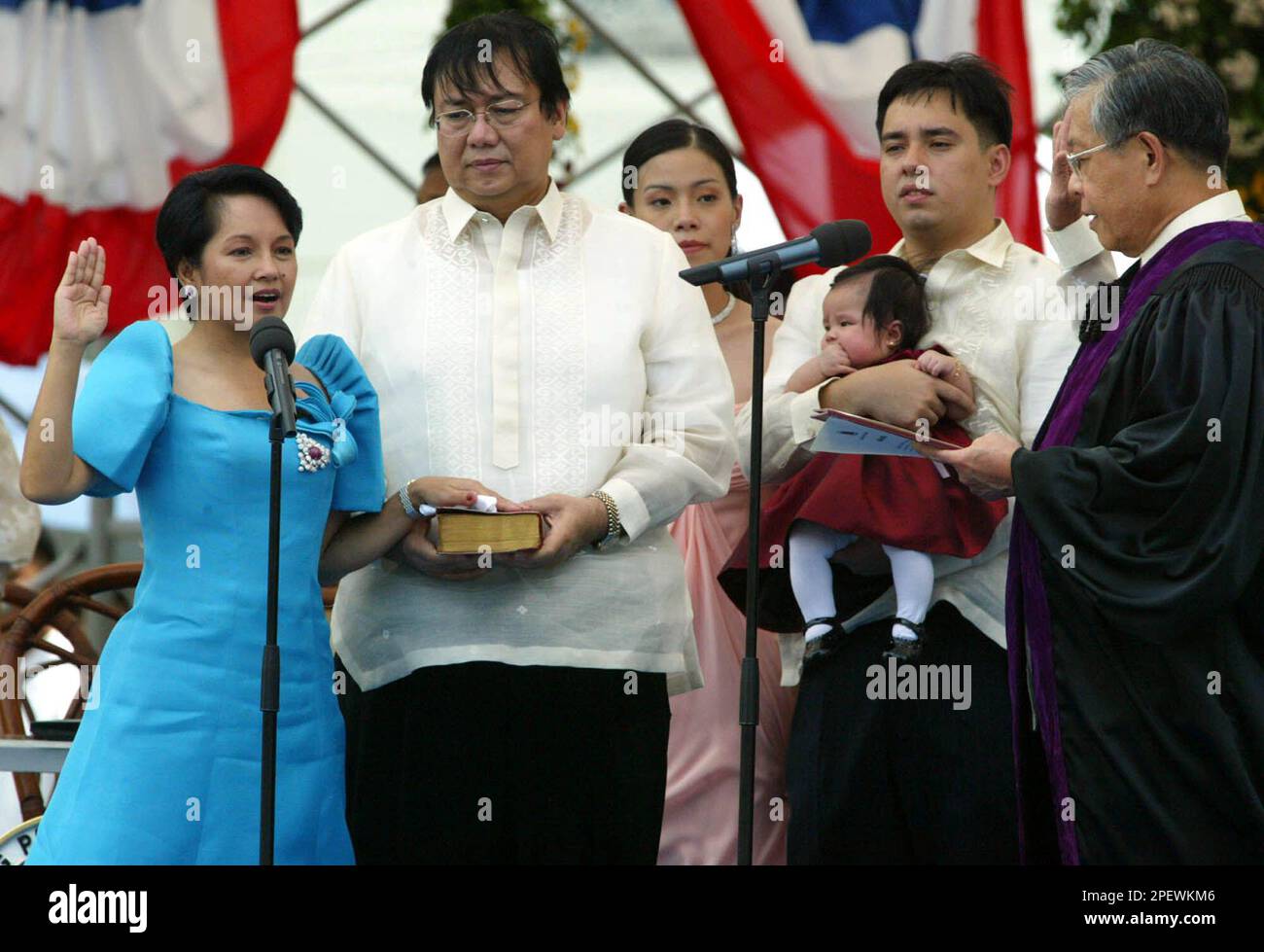 Philippine President Gloria Macapagal Arroyo (left) takes her oath as ...