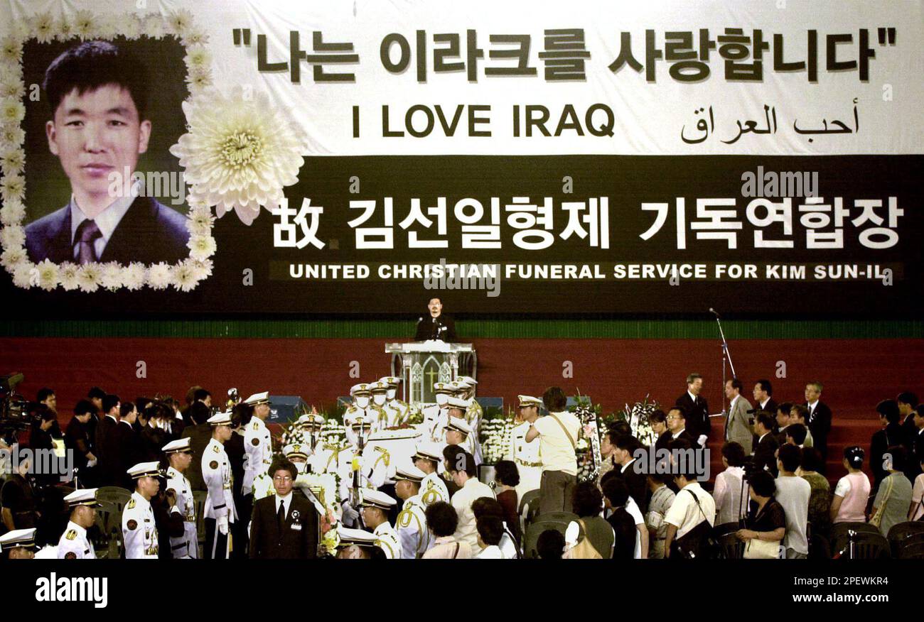 Police honor guards carry the coffin containing the body of South ...