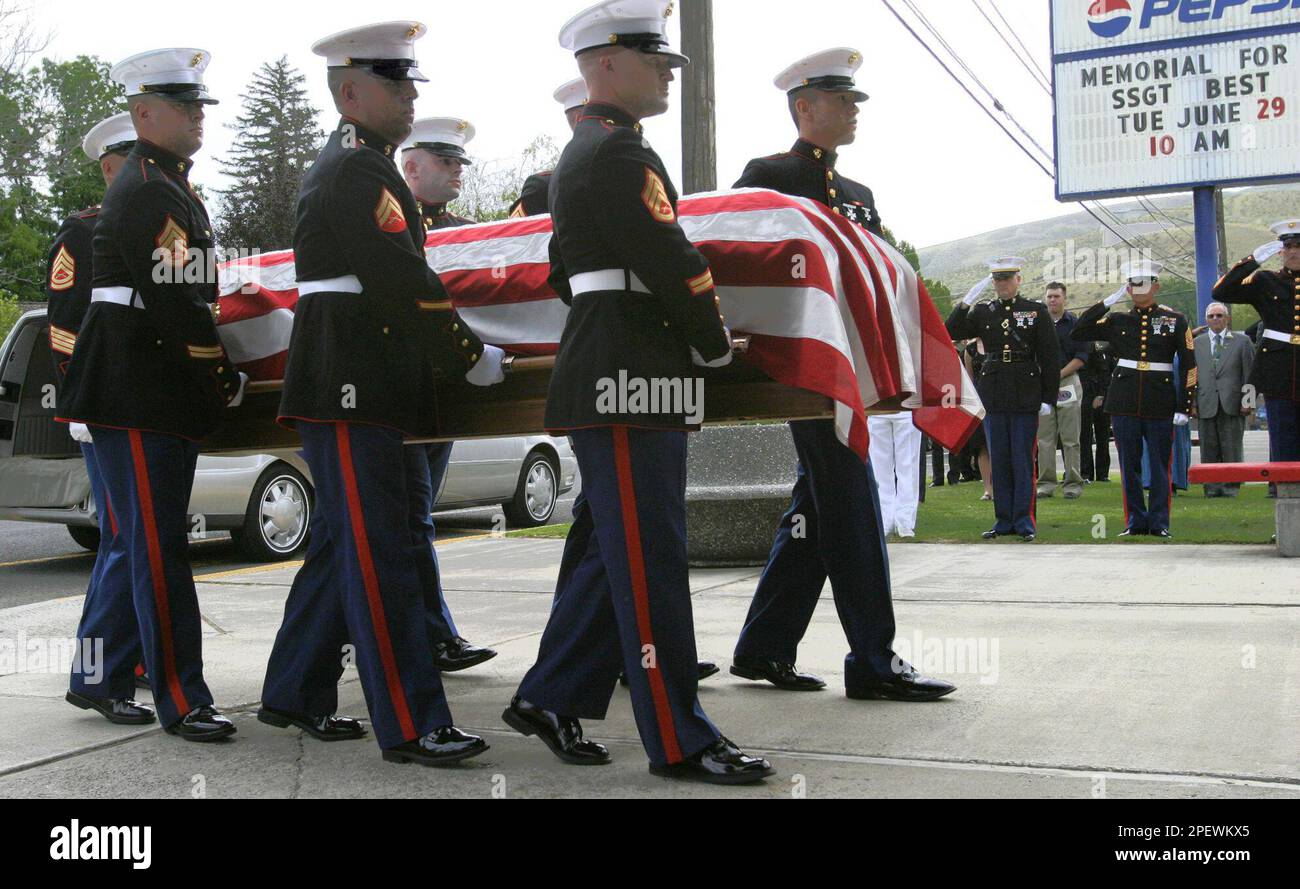 Marines carry the casket of Marine Staff Sgt. Marvin Best into the ...