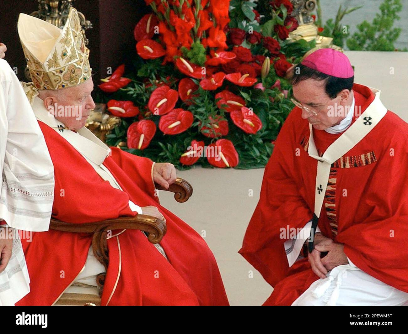 Msgr.Henry Joseph Mansell, Archbishop of Hartford, kneels in front of ...