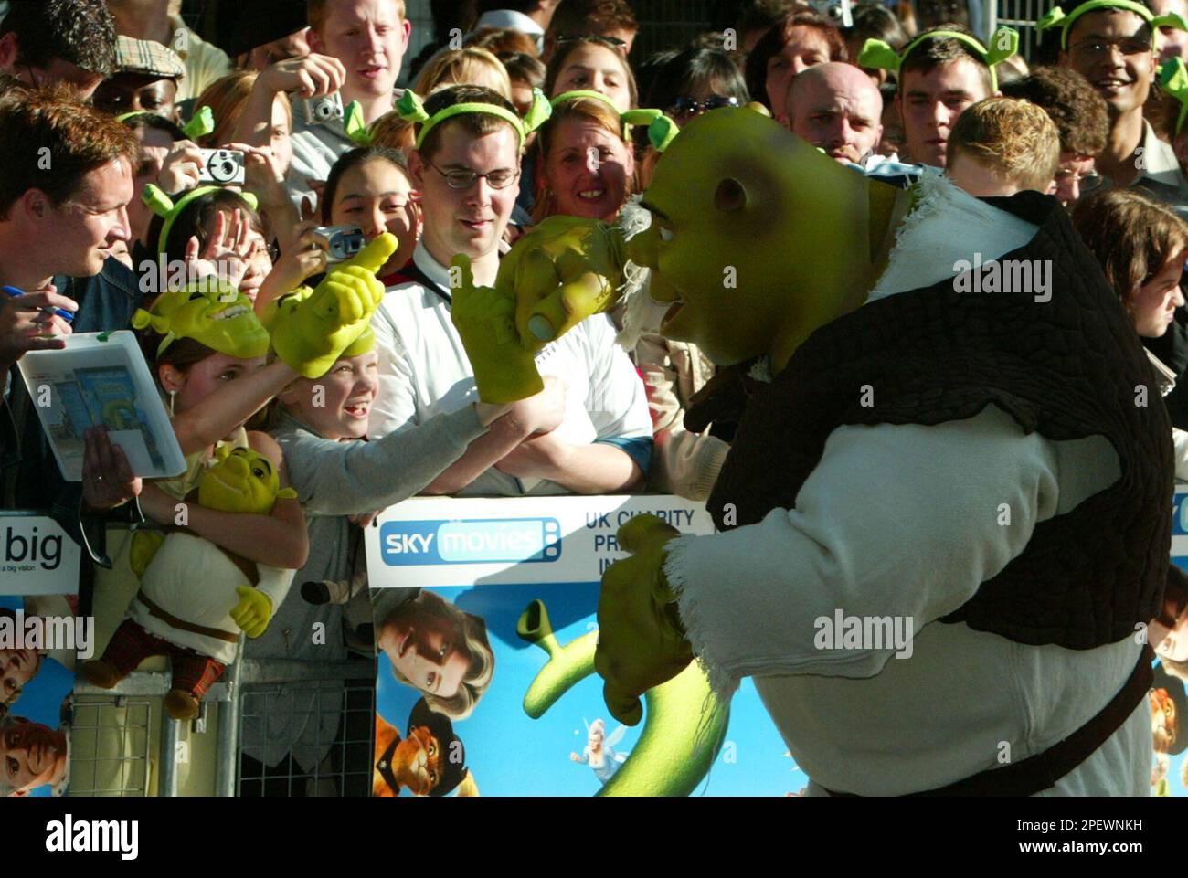 A performer dressed as the ogre Shrek entertains fans at the UK ...