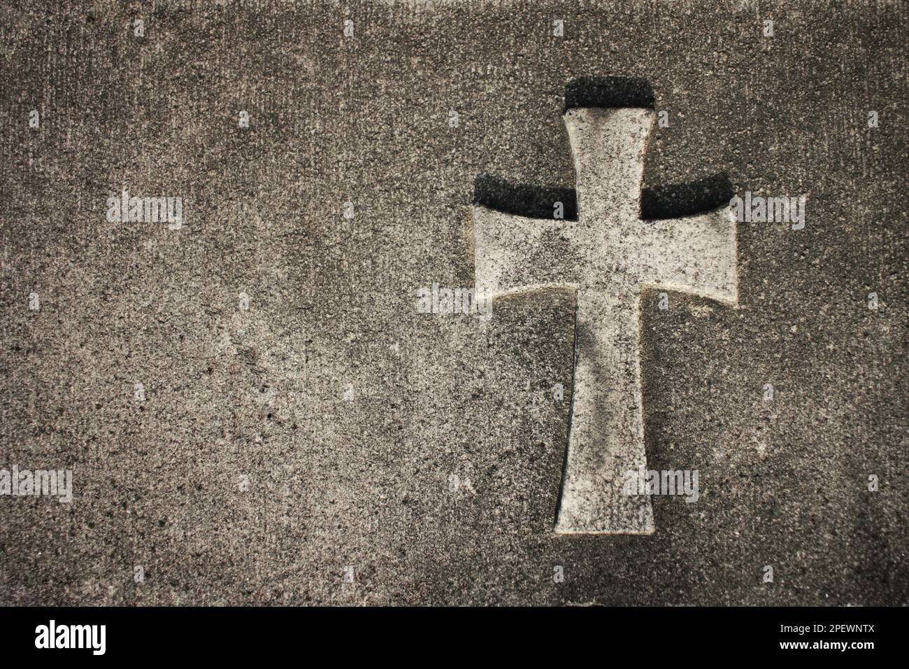 Old stone cross carved into the natural stone wall Stock Photo - Alamy