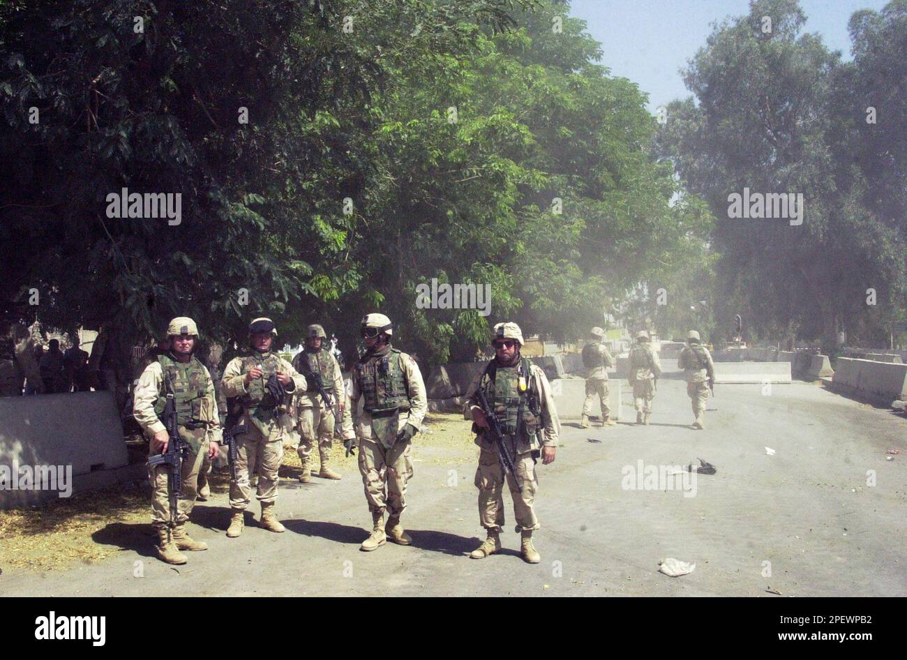 U.S. Army soldiers stand in a street in Baghdad, Iraq, Monday June 28 ...