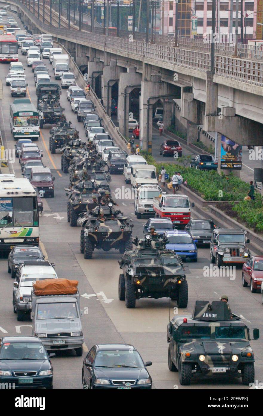 A convoy of Philippine military armored personnel carriers make their ...