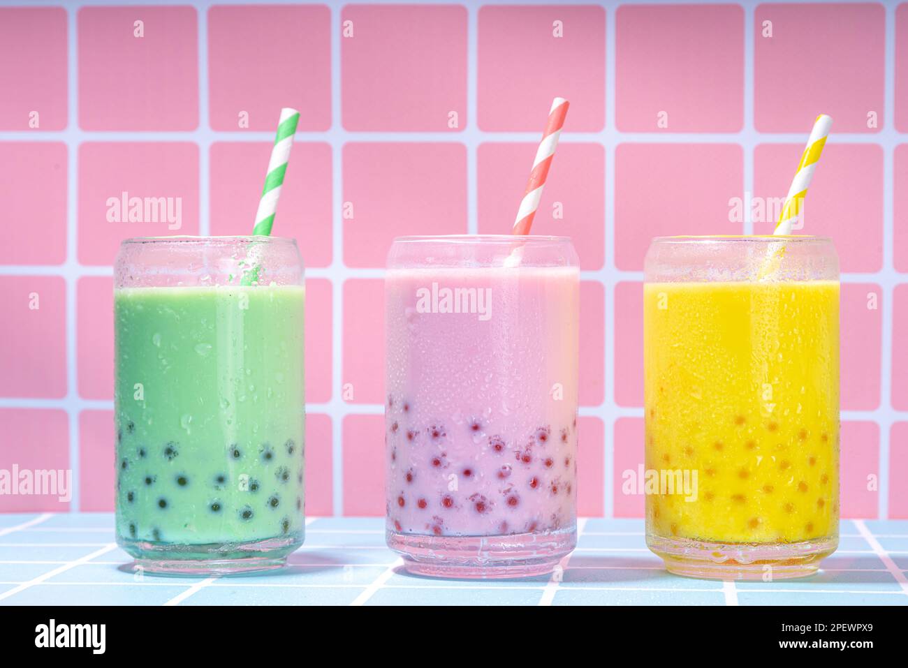 Set of three colorful summer bubble tea, bright creamy pearl tea or ...