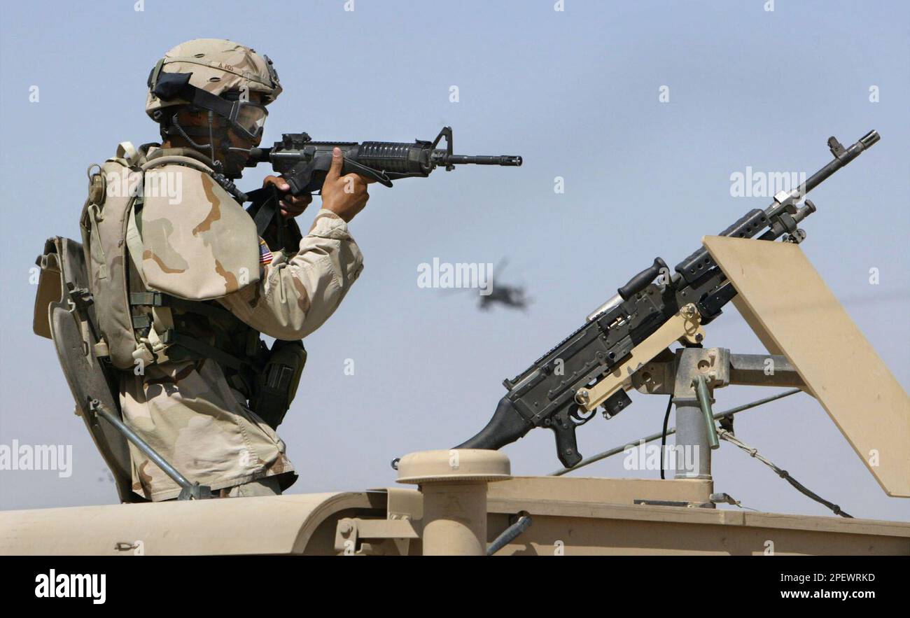 A U.S. Army soldier raises his rifle during ambush response exercises ...