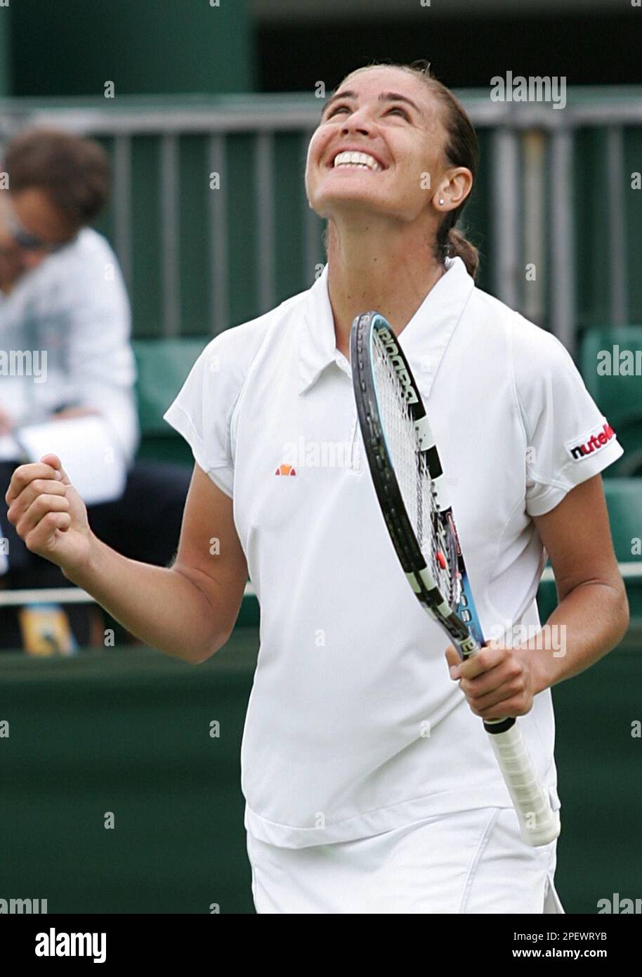 Italy's Rita Grande, reacts after defeating France's Virginie Razzano ...