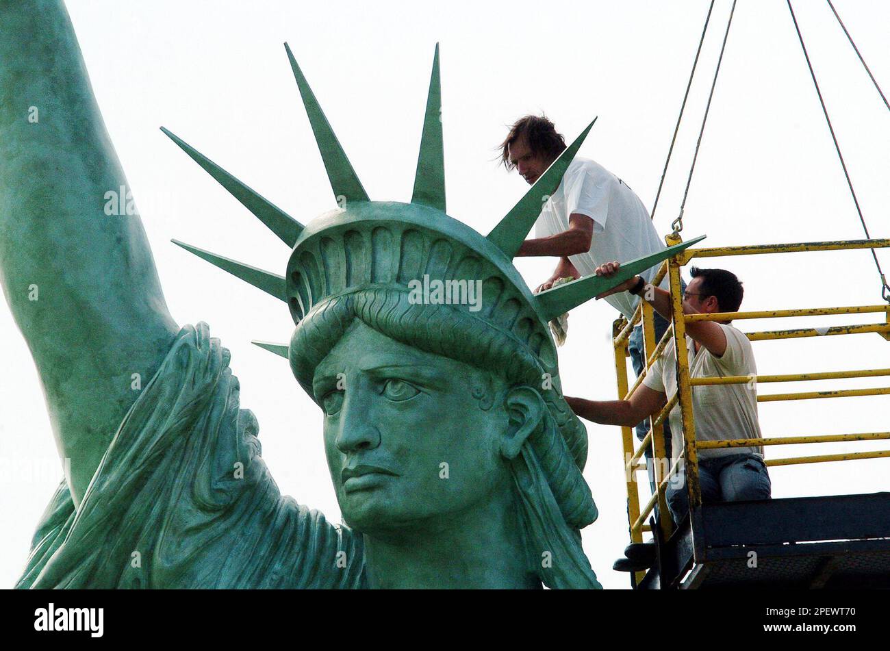 Workers of Colmar, eastern France, set up a replica of the statue of ...