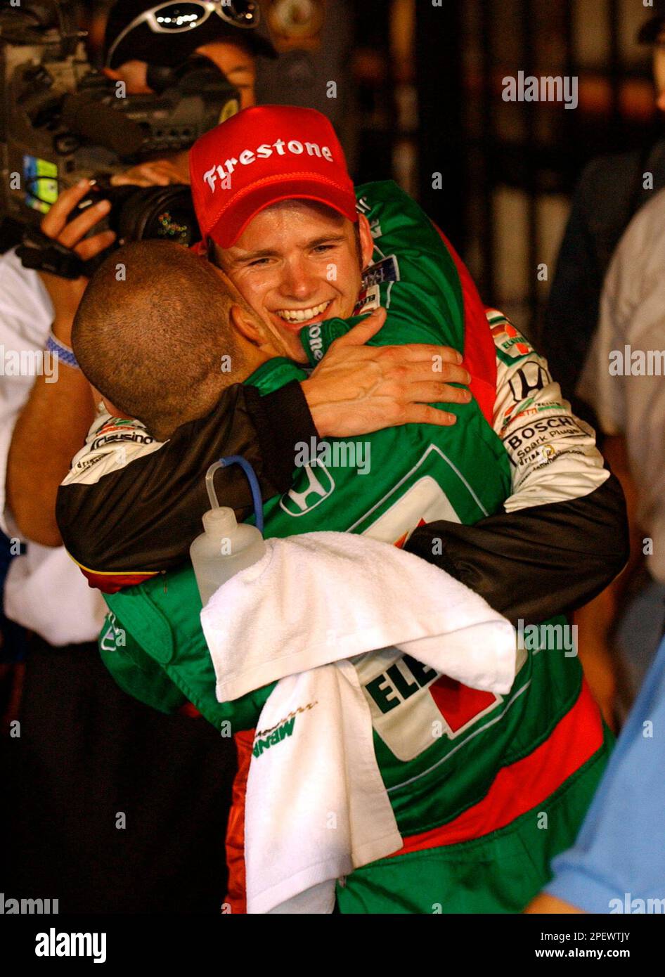 Dan Wheldon, winner of the SunTrust Indy Challenge IRL race, gets a hug ...