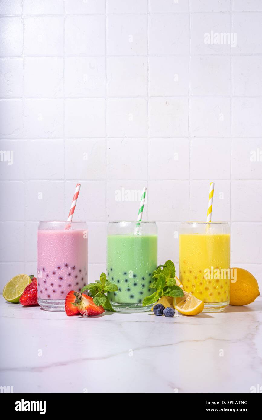 Set of three colorful summer bubble tea, bright creamy pearl tea or ...