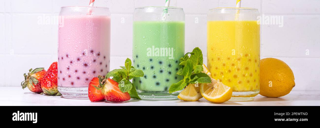 Set of three colorful summer bubble tea, bright creamy pearl tea or ...