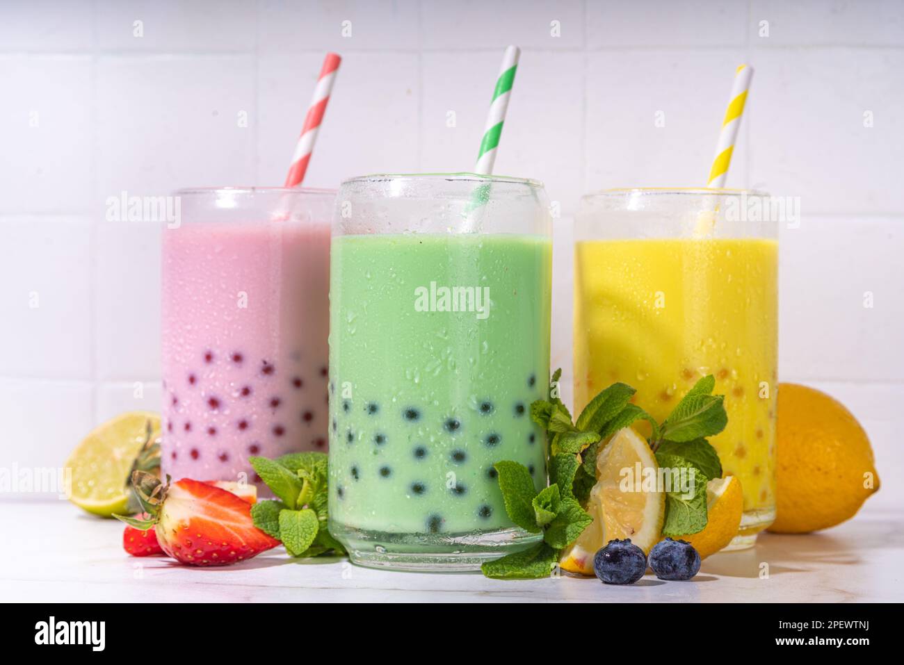 Set of three colorful summer bubble tea, bright creamy pearl tea or ...