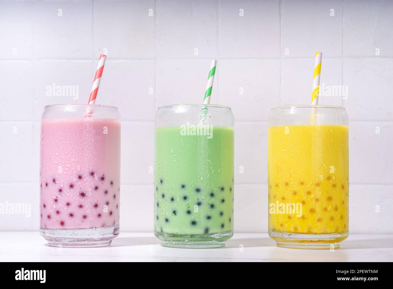 Set of three colorful summer bubble tea, bright creamy pearl tea or ...