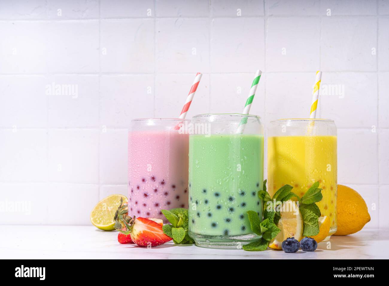 Set of three colorful summer bubble tea, bright creamy pearl tea or ...