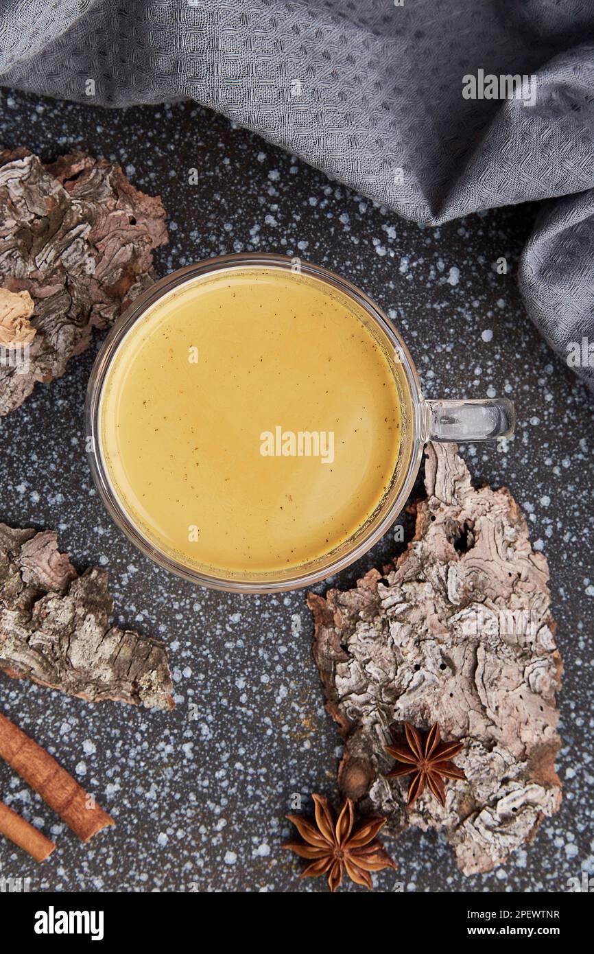 Masala tea drink with spices on tree bark. Healthy traditional indian ...