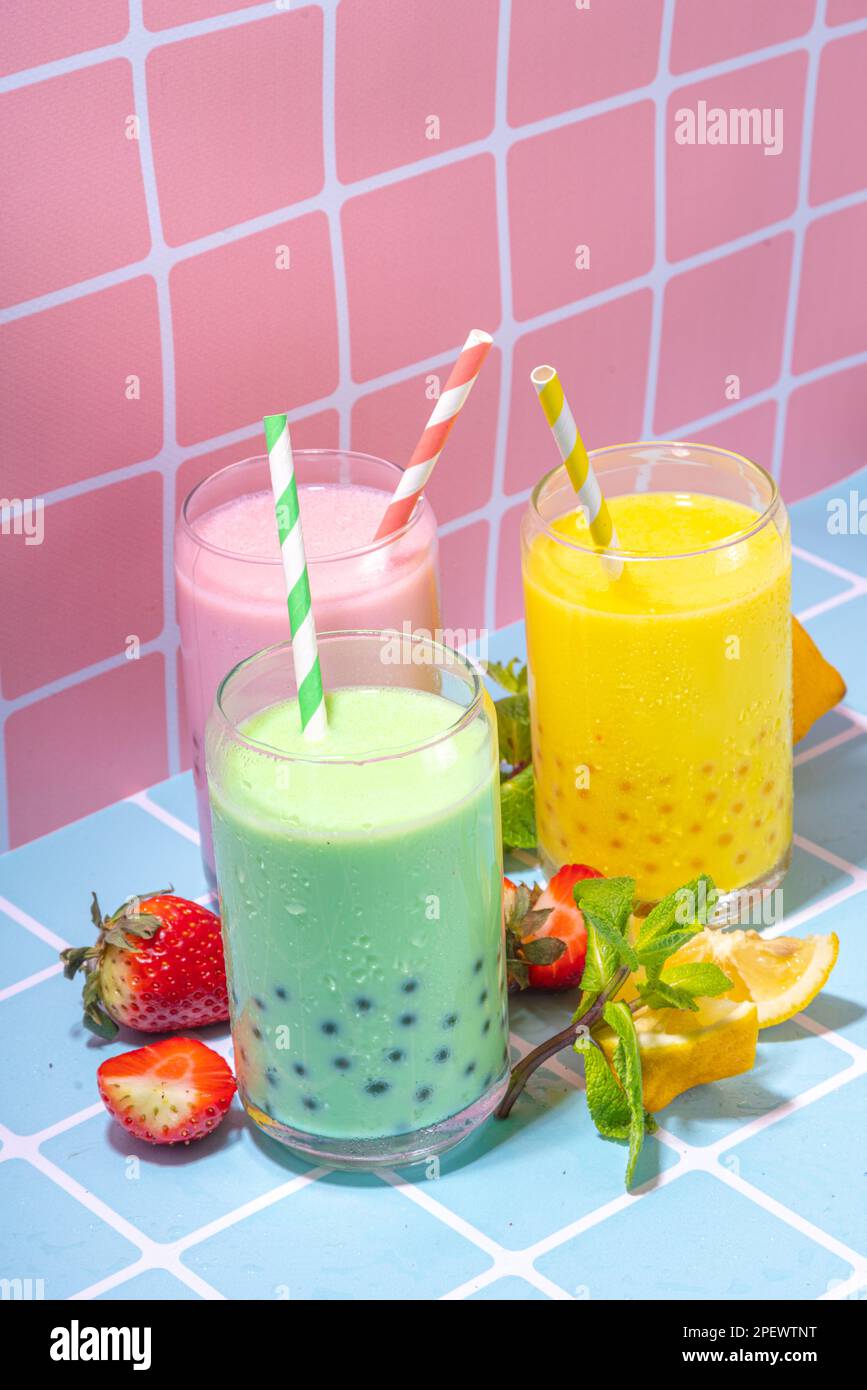 Set of three colorful summer bubble tea, bright creamy pearl tea or ...