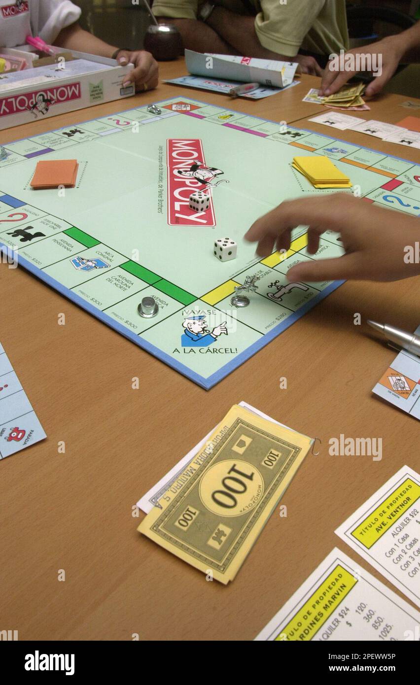 A group of people play "Monopoly" during the first national tournament ...